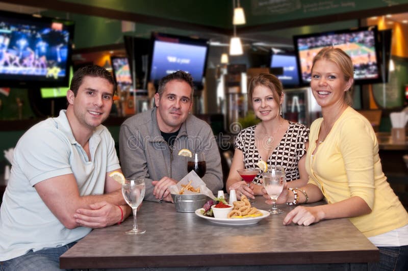 Friends in the bar stock image. Image of food, background - 12929551