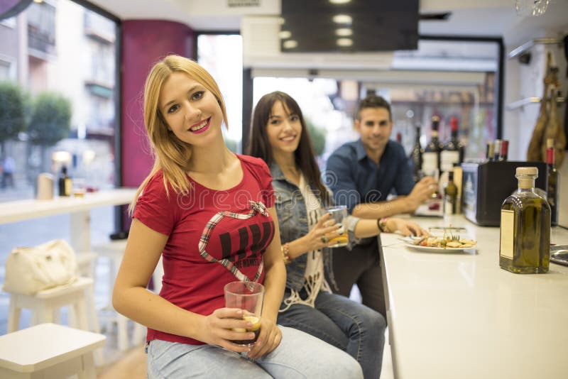 Friends in Bar, Three Young People Drinking Stock Photo - Image of ...
