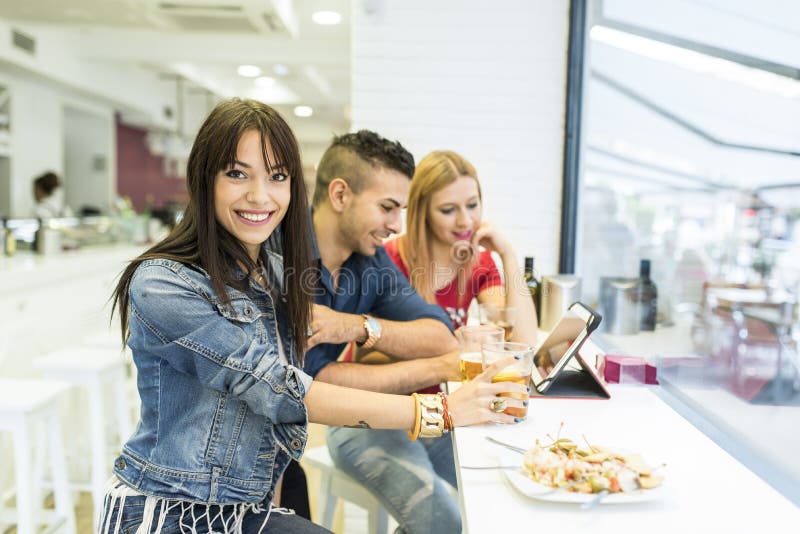 Friends in Bar, Three Young People Drinking in Restaurant Stock Image ...