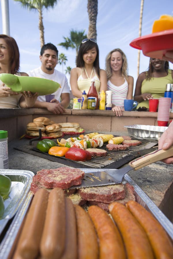 Group of Friends Having Outdoor Barbeque at Home Stock Image - Image of ...