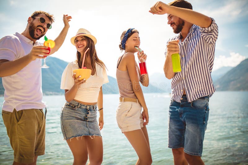 Friends at the Beach Drinking Cocktails Having Fun on Summer Vacation ...