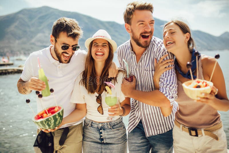 Friends at the Beach Drinking Cocktails Having Fun on Summer Vacation ...