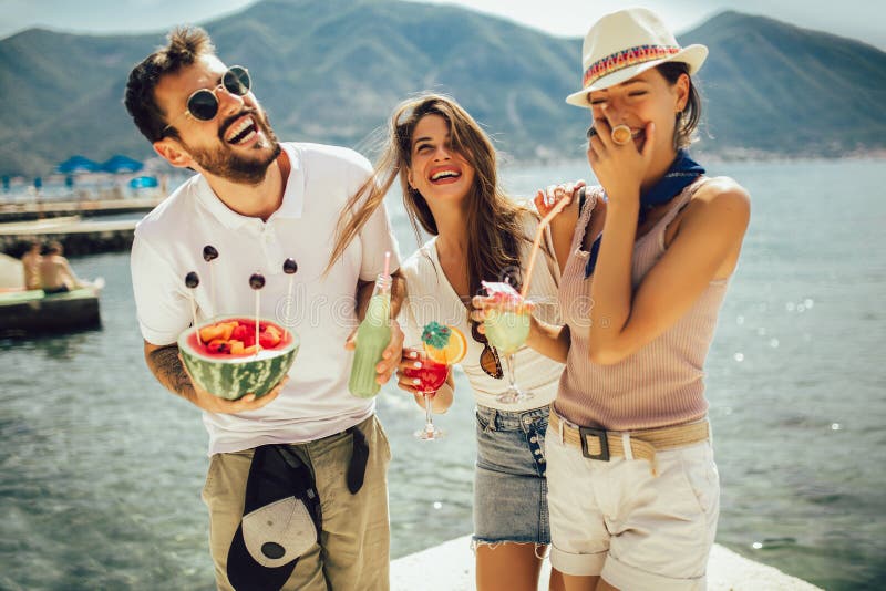 Friends at the Beach Drinking Cocktails Having Fun on Summer Vacation ...