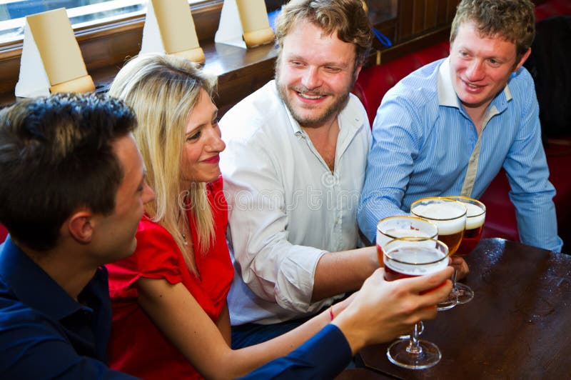Friends with beer in a pub stock photo. Image of friendship - 40978822