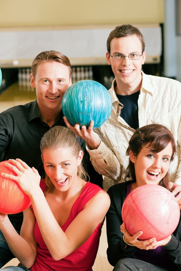 Friends bowling having fun stock photo. Image of women - 17918464