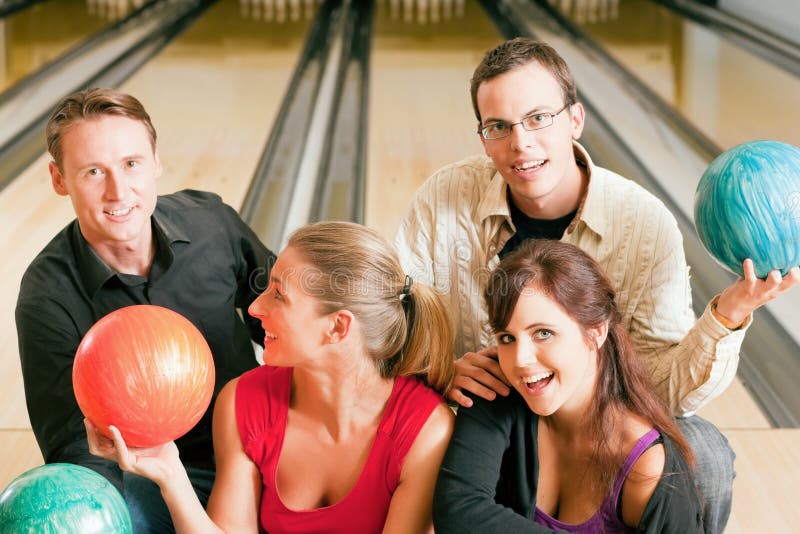 Friends bowling together stock image. Image of indoor - 12169527