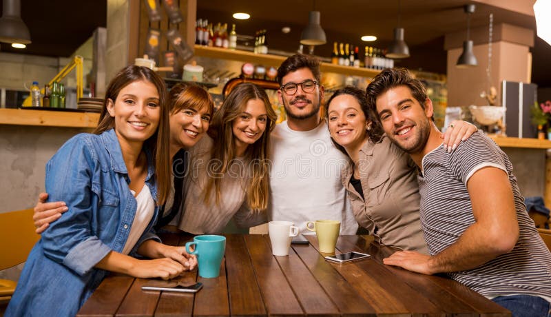 Friends at the cafe stock image. Image of beverage, meeting - 124604461