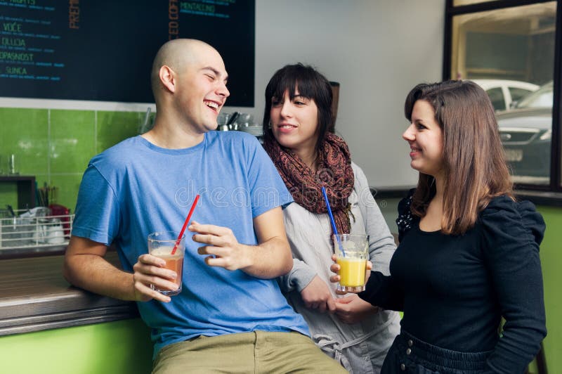 Friends in cafe having fun stock image. Image of three - 23224607
