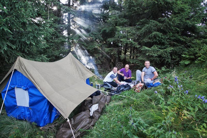 Friends in the Campaign with a Tent in the Forest. Stock Image - Image ...