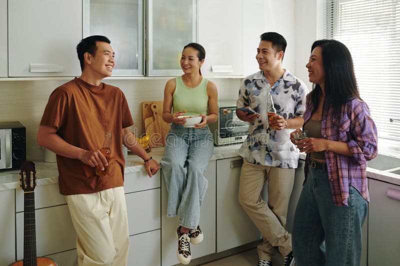 Casually Talking and Snacking in the Kitchen Stock Image - Image of ...