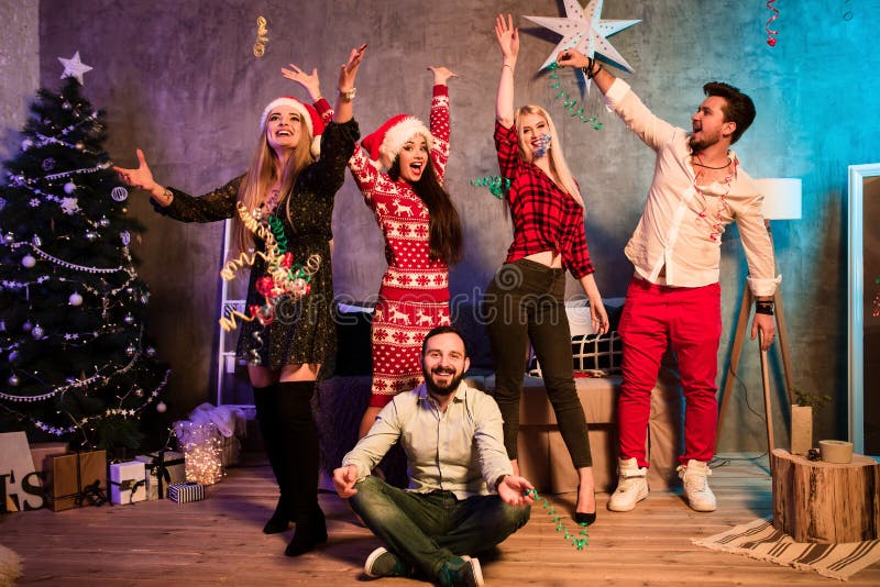 Friends Celebrating Christmas or New Year Eve at Home Stock Photo ... Friends Celebrating Christmas or New Year Eve at Home Stock Photo ...