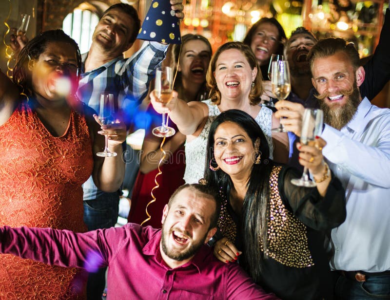 Friends Celebrating Together at a Christmas Party in a Bar Stock Photo ...