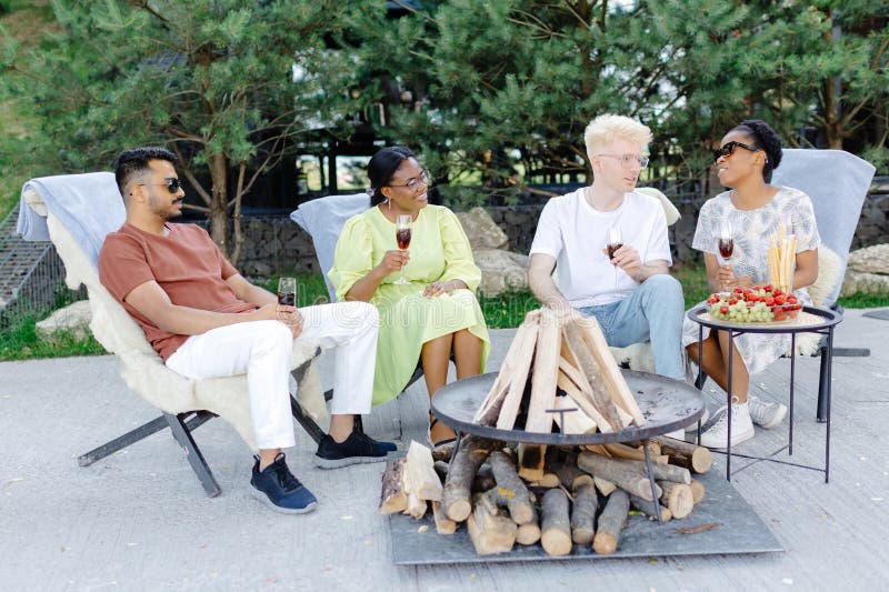 Friends Celebrating Outside, Drinking Wine and Eating Fruit on a Picnic ...