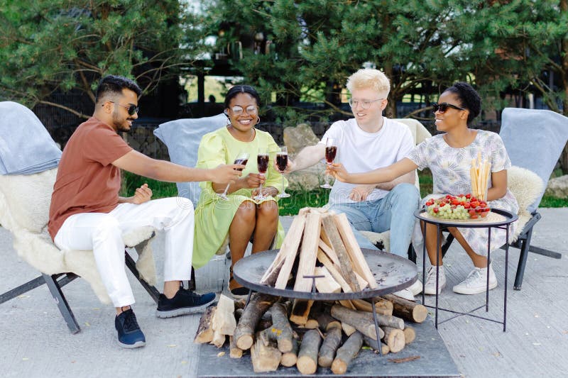 Friends Celebrating Outside, Drinking Wine and Eating Fruit on a Picnic ...
