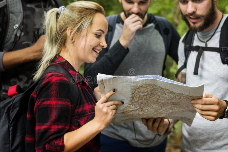 Friends Checking the Map for Directions Stock Photo - Image of ...