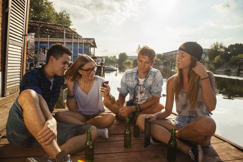 Friends Chilling Having Fun Near Lake Stock Photo - Image of drink ...