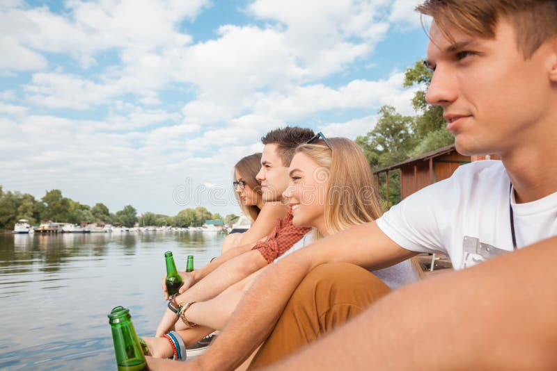 Friends Chilling Near Lake stock photo. Image of people - 45194454