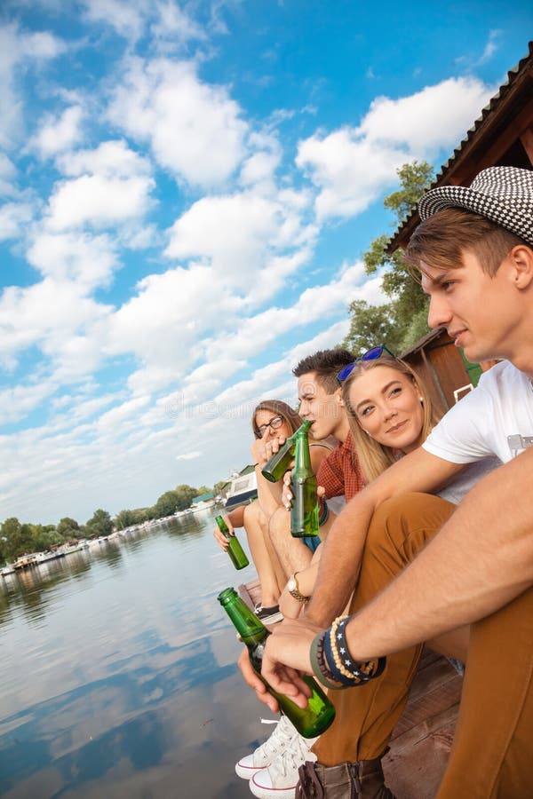 Friends Chilling Near Lake stock photo. Image of people - 57787672