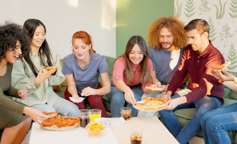 Friends Chilling and Smiling Eating Pizza Together at Home Stock Photo ...