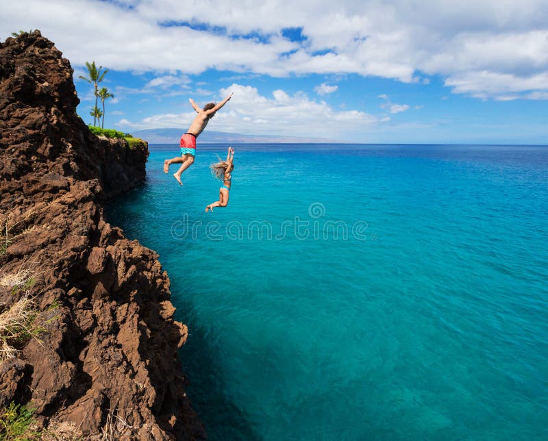 Friends Cliff Jumping into the Ocean Stock Photo - Image of movement ...