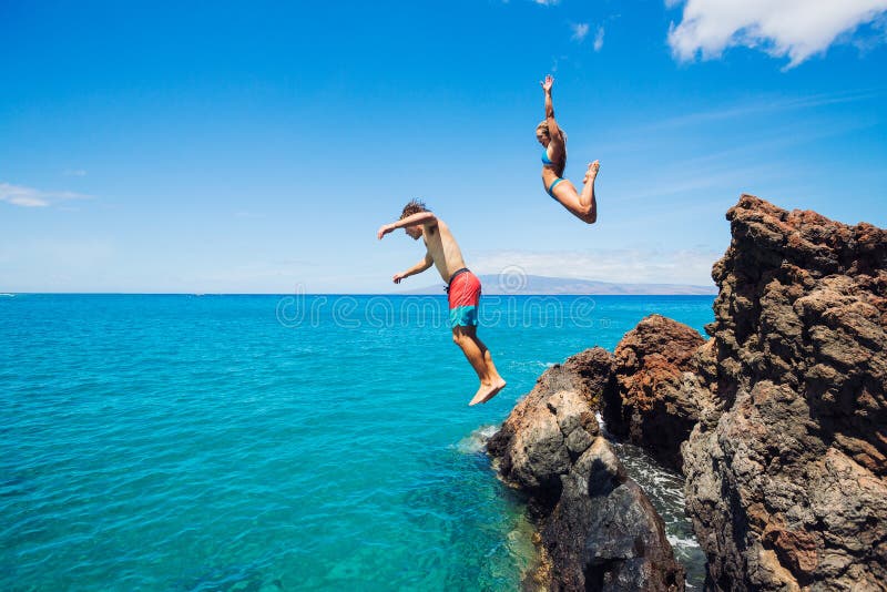Friends Cliff Jumping into the Ocean Stock Photo - Image of fail ...