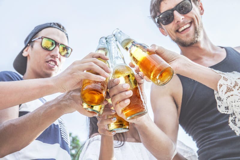 Friends clinking beer stock image. Image of bottle, party - 71367189