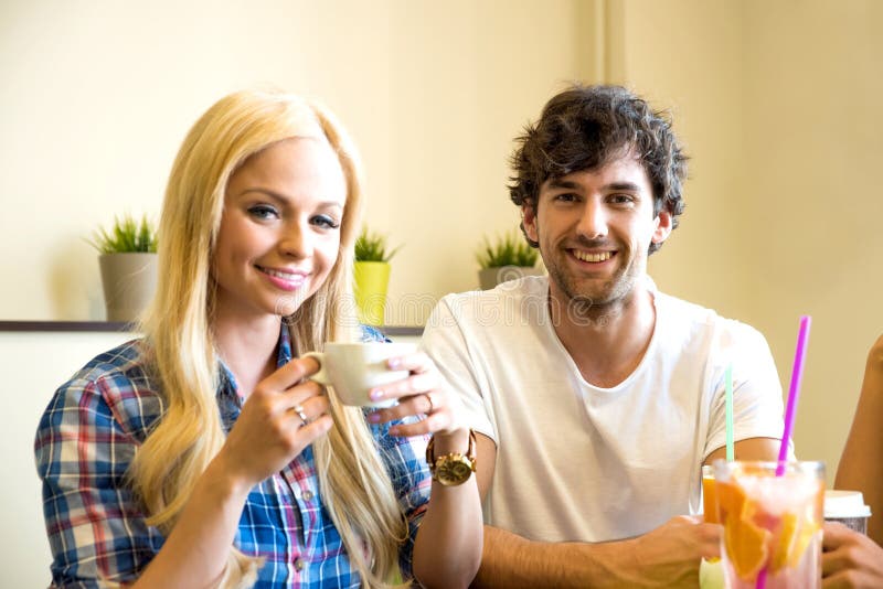 Friends in a coffee shop stock image. Image of positive - 71669793