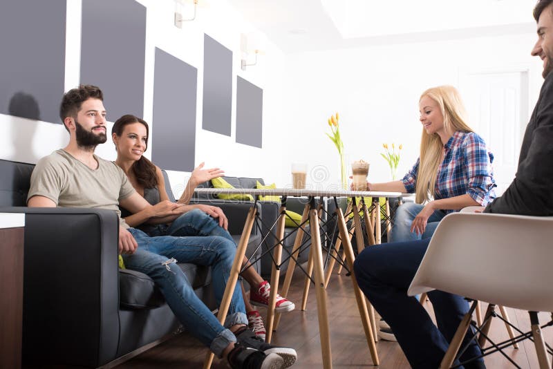 Friends in a coffee shop stock image. Image of positive - 71669793