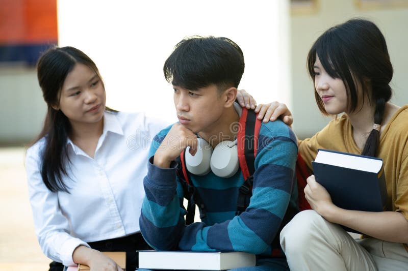 Friends Comforting Stressed Student on Campus Stock Image - Image of ...