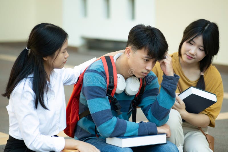 Friends Comforting Stressed Student on Campus Stock Image - Image of ...
