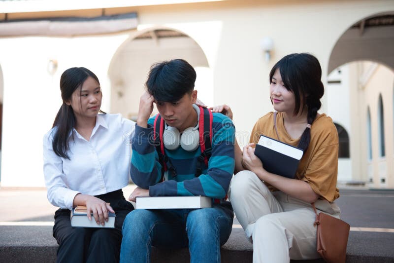 Friends Comforting Stressed Student on Campus Stock Image - Image of ...