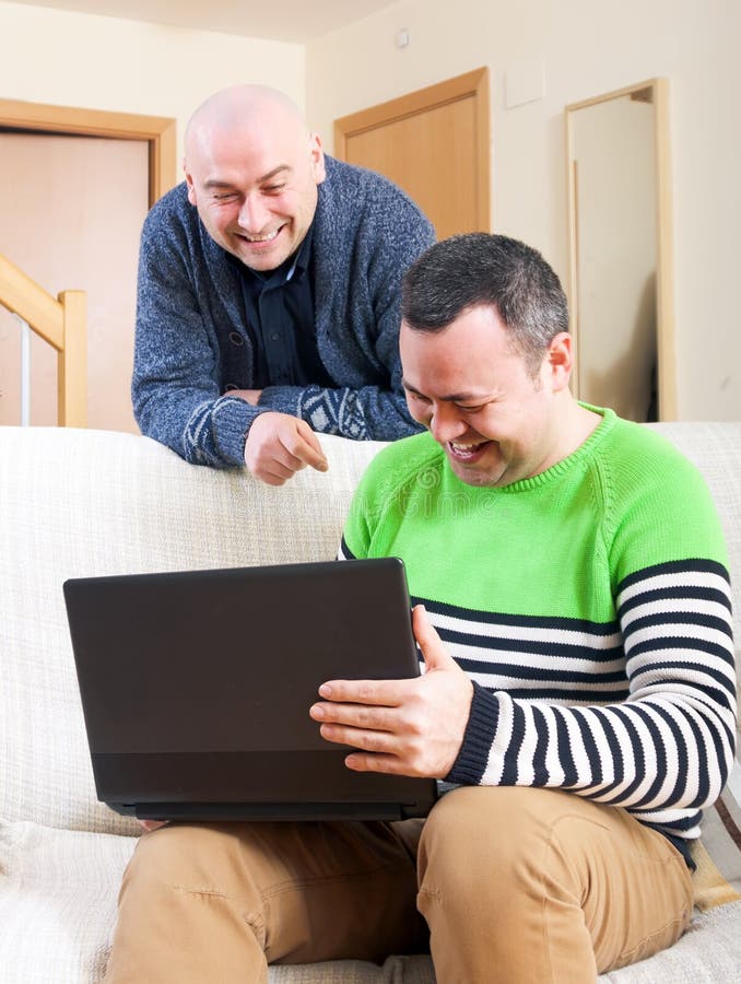 Friends at Computer in Home Stock Image - Image of male, caucasian ...