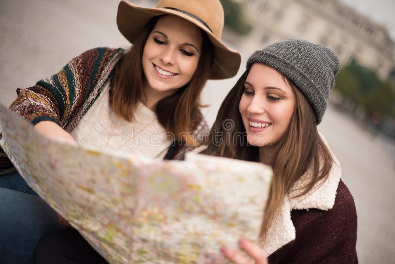 Friends Consulting a City Map Stock Image - Image of sightseeing, city ...