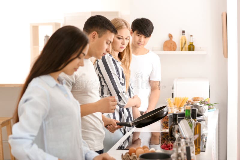 Friends Cooking Together in Kitchen Stock Photo - Image of people ...