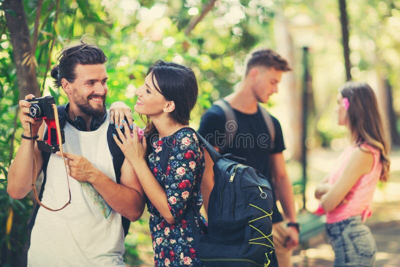 Friends or Couples Having Fun with Photo Camera in Park Stock Image ...