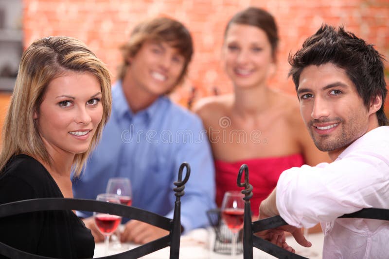 Two couples dining out stock image. Image of iron, chair - 35933235