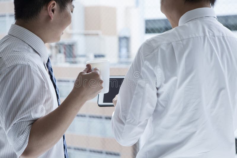 Friends Discuss Two Men during a Work Break Stock Photo - Image of ...