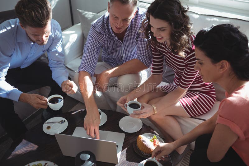 Friends Discussing Over Laptop Stock Photo - Image of happy, casual ...