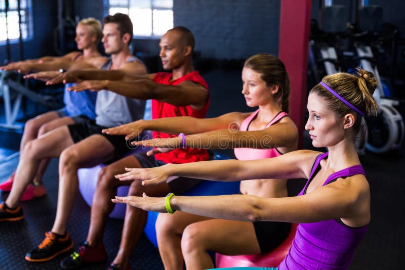 Friends Doing Stretching Exercise Stock Image - Image of looking ...