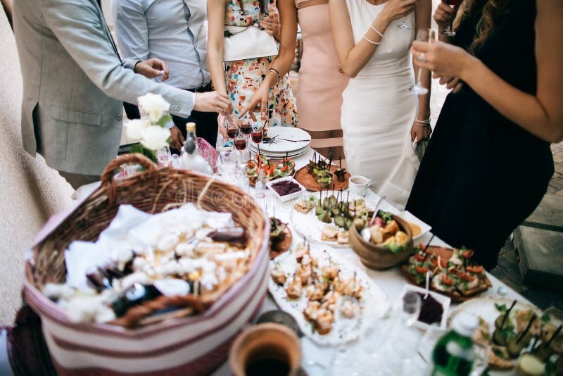 Friends Drink Alcohol and Eat Snacks and Talk at the Celebration of the ...