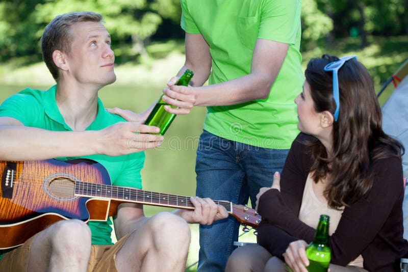 Friends Drinking Beer on a Camping Stock Photo - Image of enjoy, drink ...