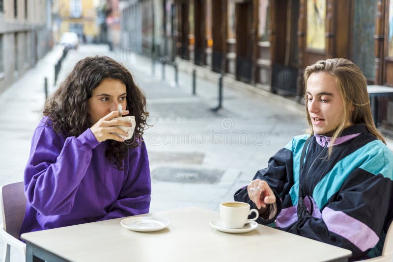 Friends Drinking Coffee while Sitting at Outdoors. Stock Image - Image ...