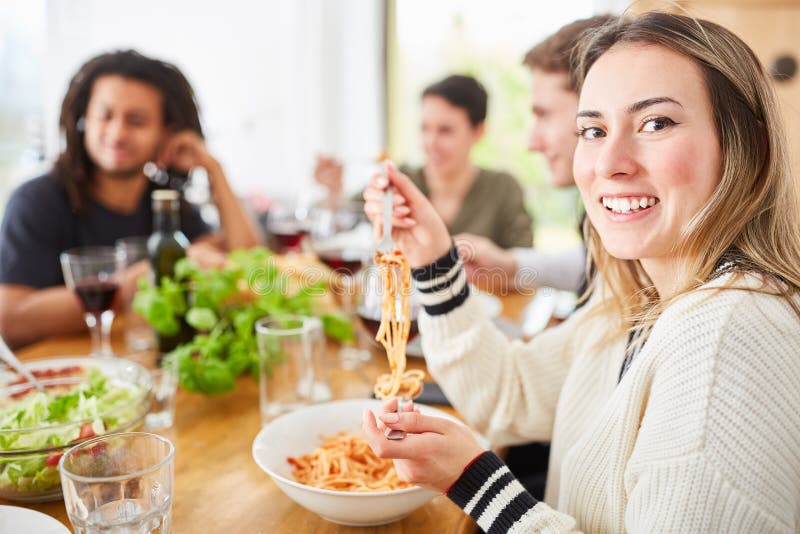 Friends Eat Spaghetti with Tomato Sauce in Shared Flat Stock Photo ...