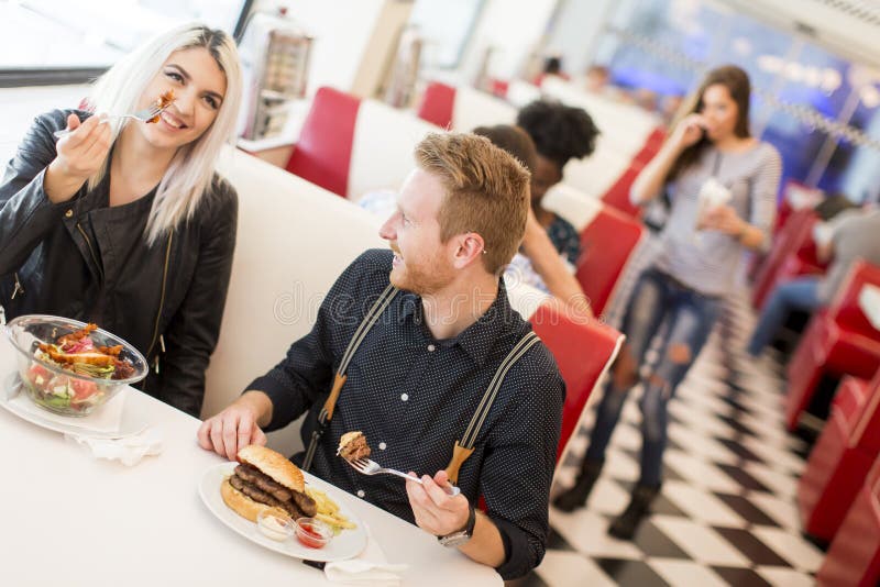 Friends eating in diner stock photo. Image of american - 79172232