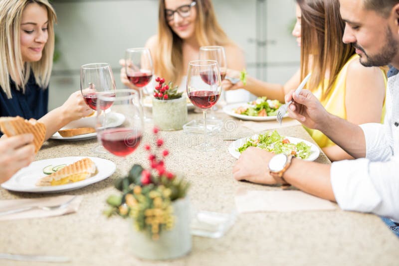 Friends Eating Dinner in a Restaurant Stock Image - Image of good, food ...