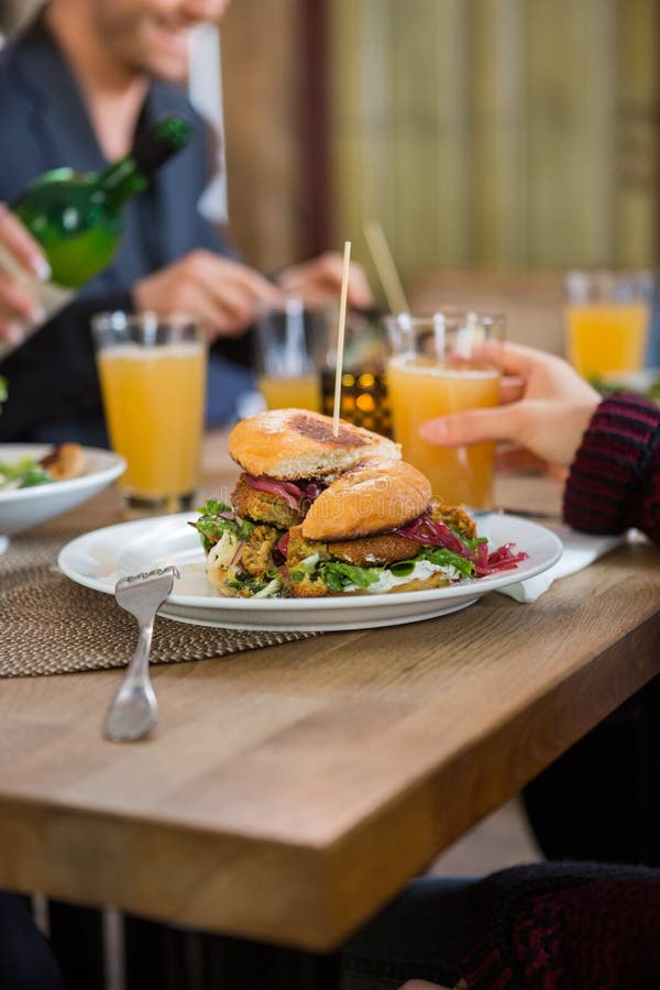 Friends Eating Lunch at Cafe Stock Image - Image of person, bread: 36985277