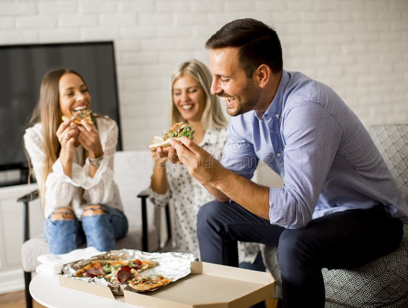 Friends Eating Pizza at Home Stock Photo - Image of friendship, lunch ...