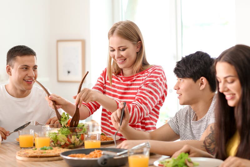 Friends Eating at Table in Kitchen Stock Image - Image of dinner ...