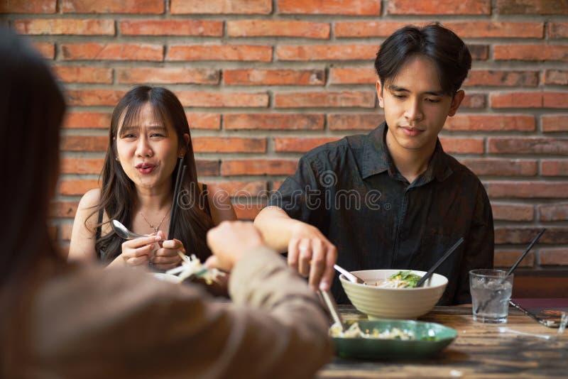 Friends Eating Together in Restaurant and Having Fun Stock Photo ...