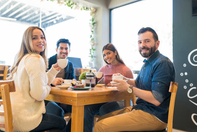 Friends Enjoying Coffee at Restaurant Stock Image - Image of four ... Friends Enjoying Coffee at Restaurant Stock Image - Image of four ...